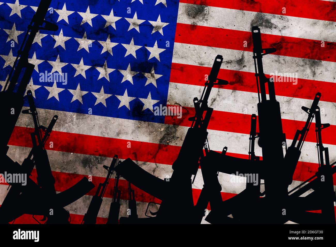 Several automatic rifles raised up on the background of the American ...