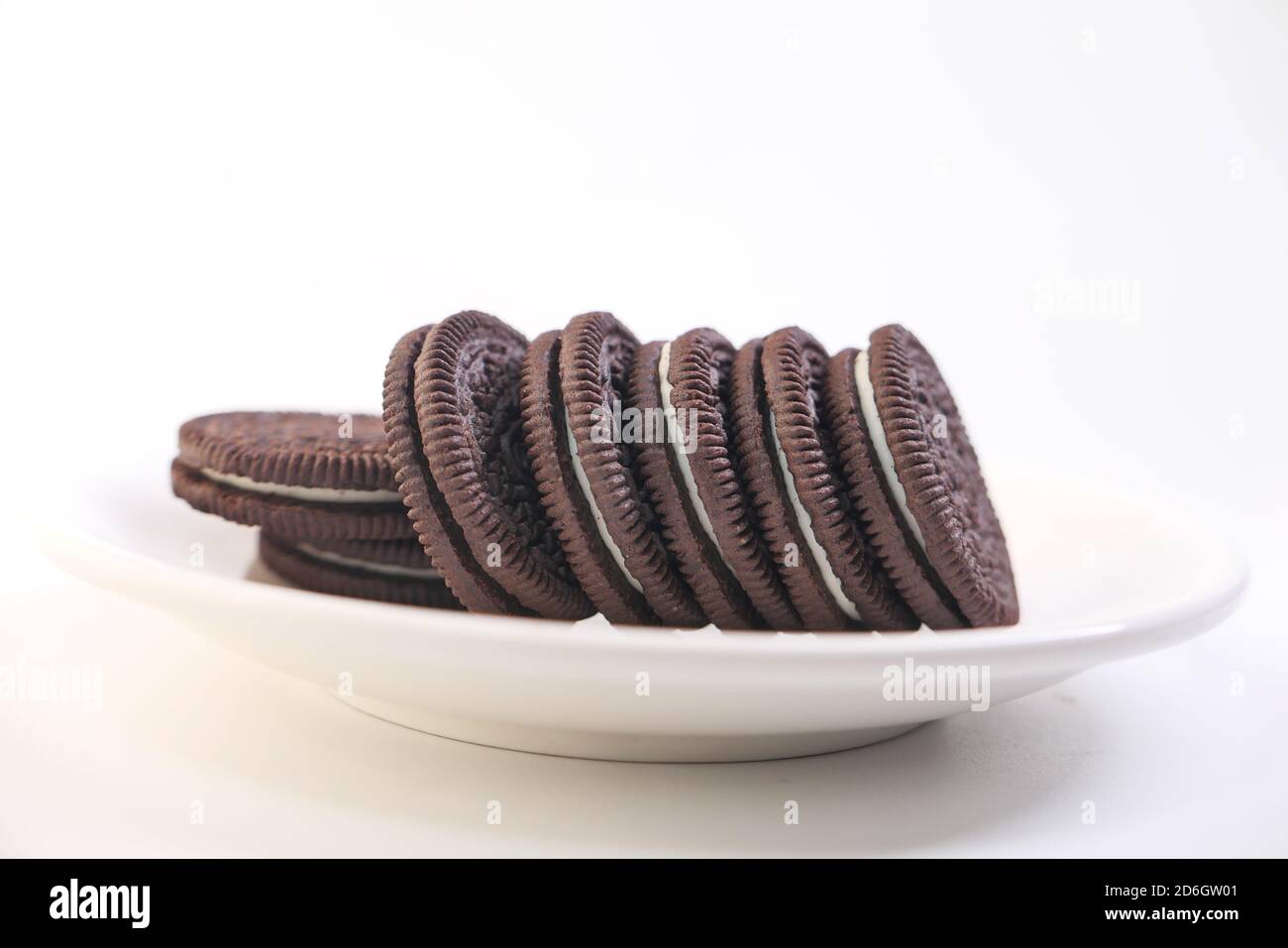 homemade chocolate biscuits on plate isolated on white Stock Photo - Alamy