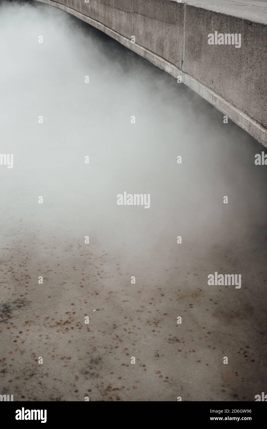 Urban detail with fog or contamination on the ground Stock Photo - Alamy