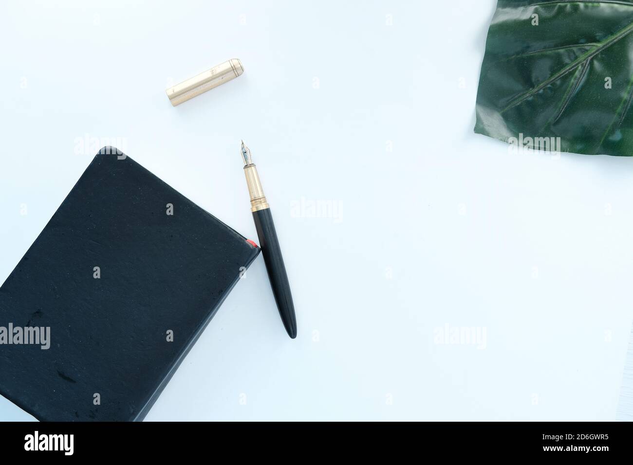 top view of a diary and fountain pen on white background Stock Photo ...