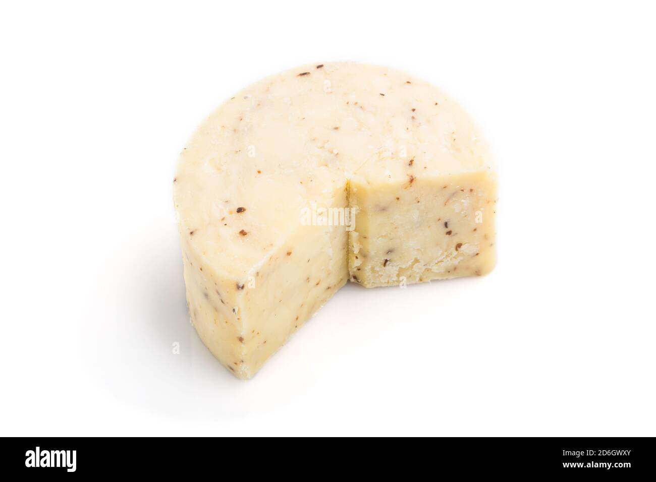 Piece of cheddar cheese isolated on white background. Side view, close ...
