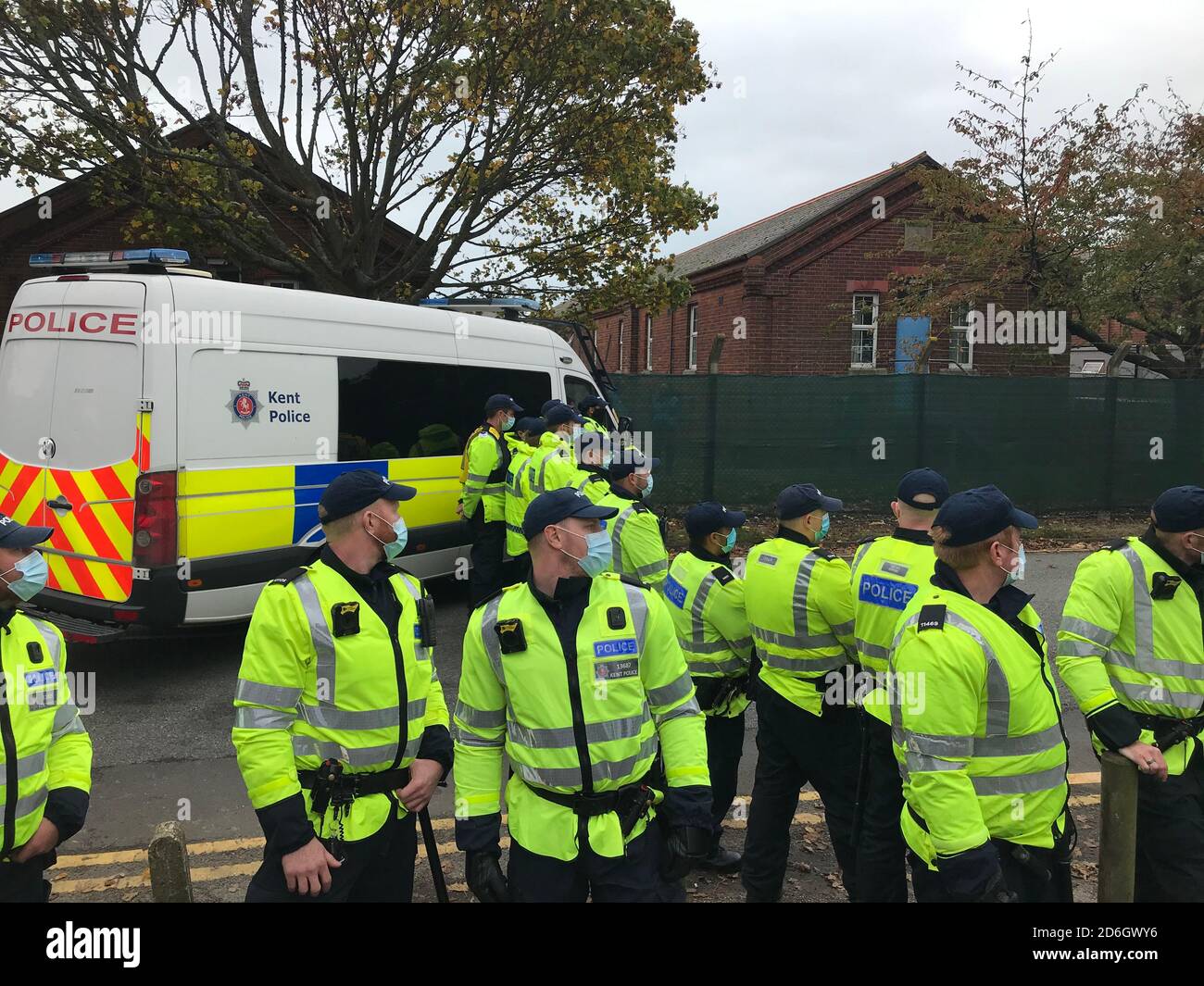Police officers observe a demonstration outside napier barracks in ...
