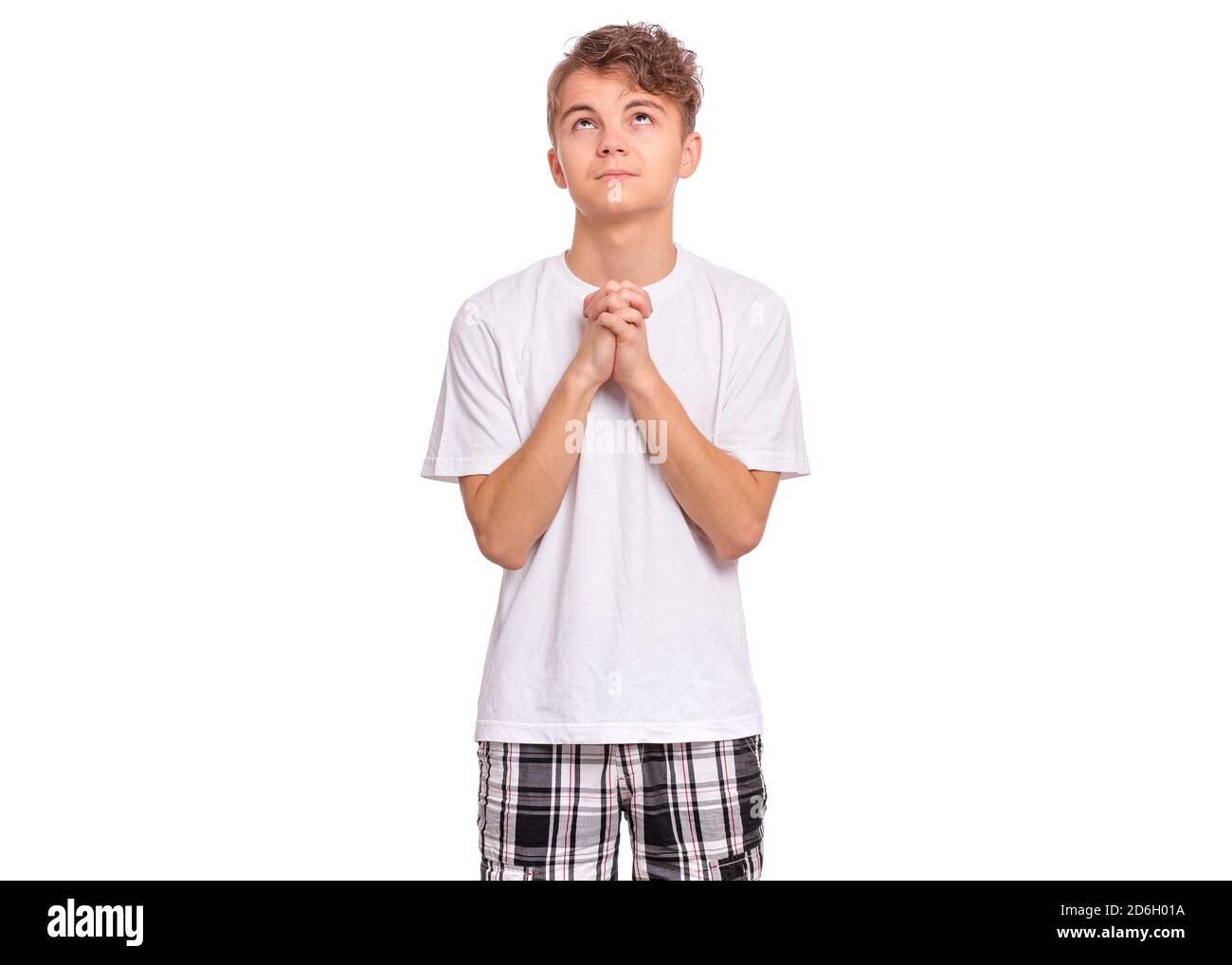 Handsome teen boy with hands folded in prayer hoping for better ...