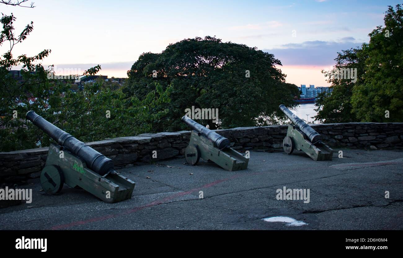 Classic Cannons On Guard Tower Overlooking Bay and village in Stavanger ...
