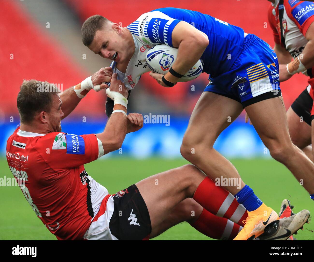 Leeds Rhinos' Ash Handley (right) is tackled by Salford Red Devils Lee ...