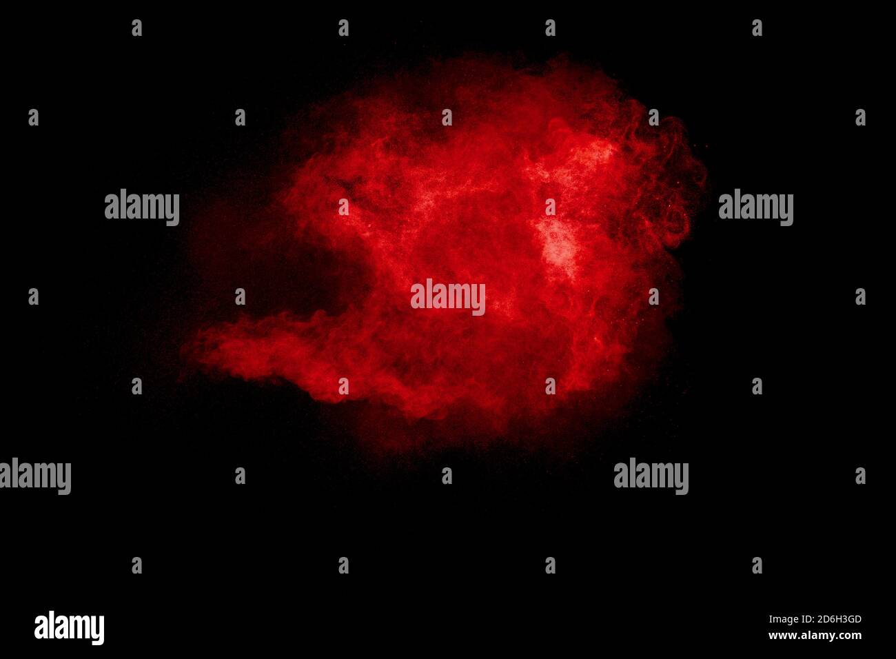 Red color powder explosion on black background Stock Photo - Alamy