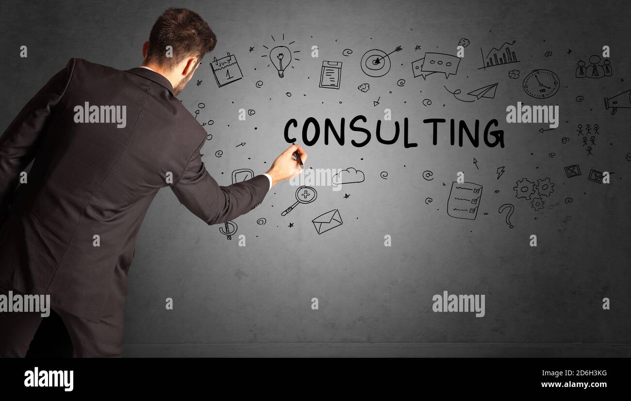 businessman drawing a creative idea sketch with CONSULTING inscription ...