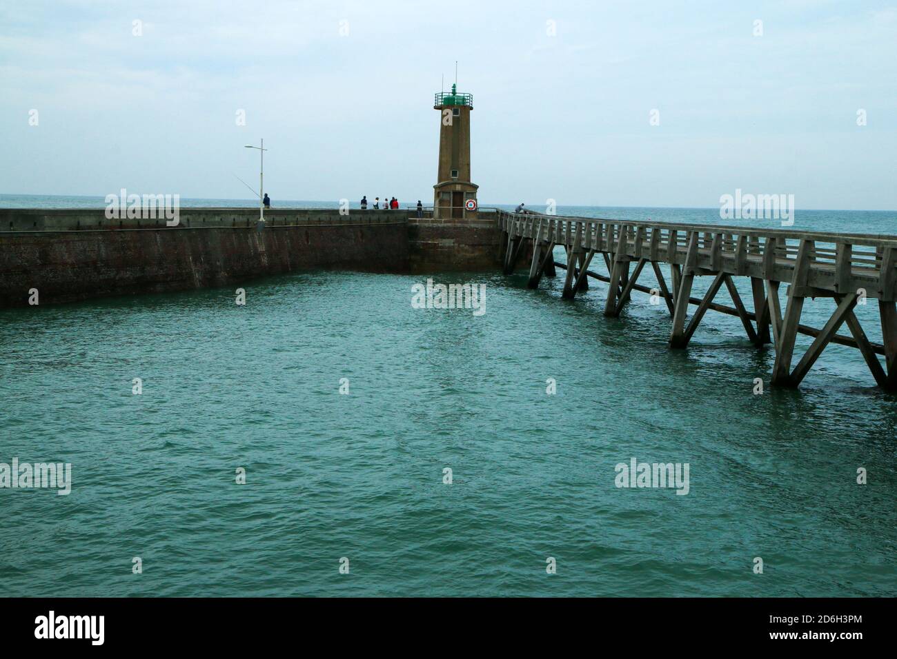 The wooden pedestrian bridges over the sea water leading to the ...