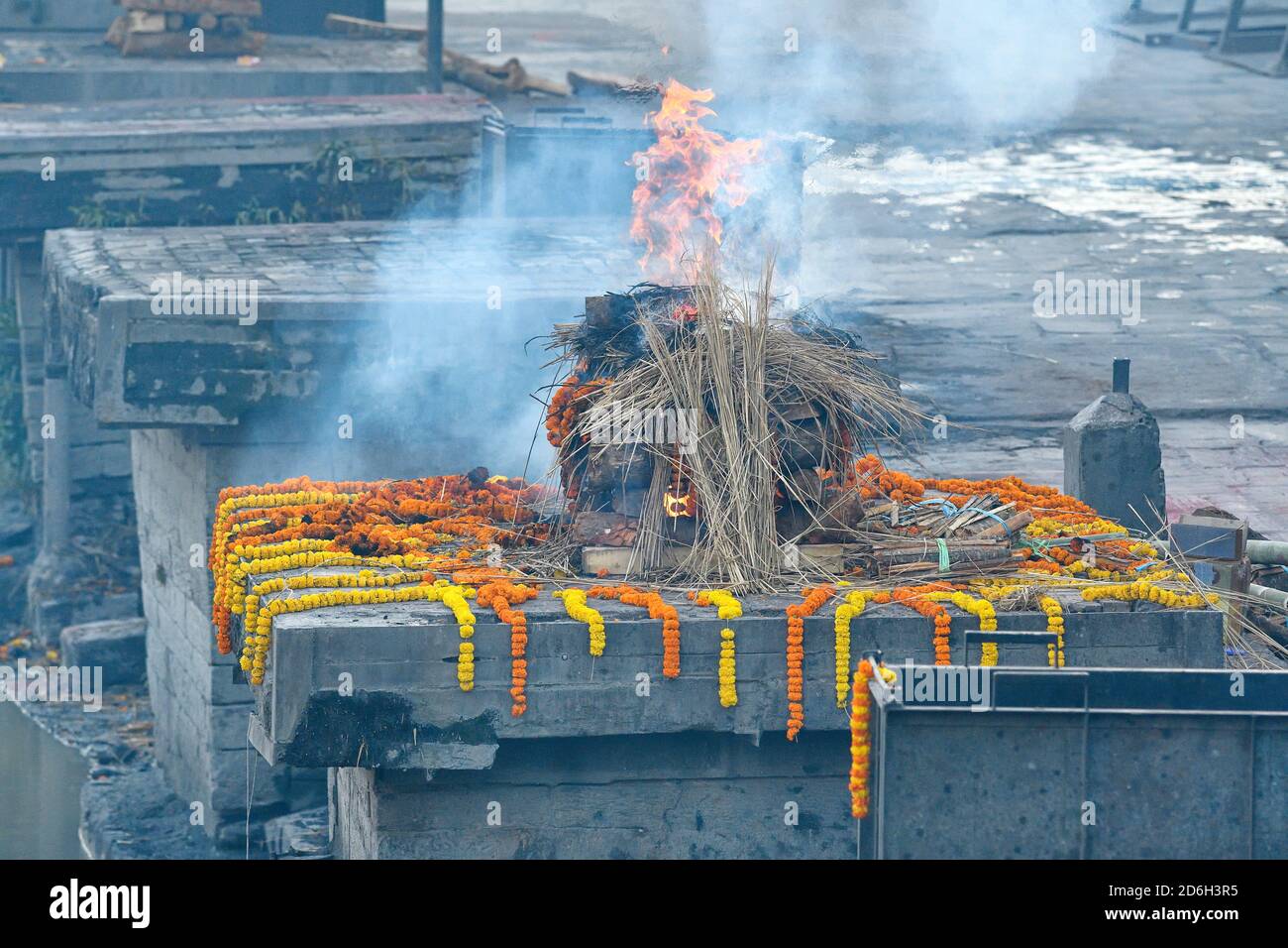 Body being cremated at the cremation ghat, Pashupatinath temple ...