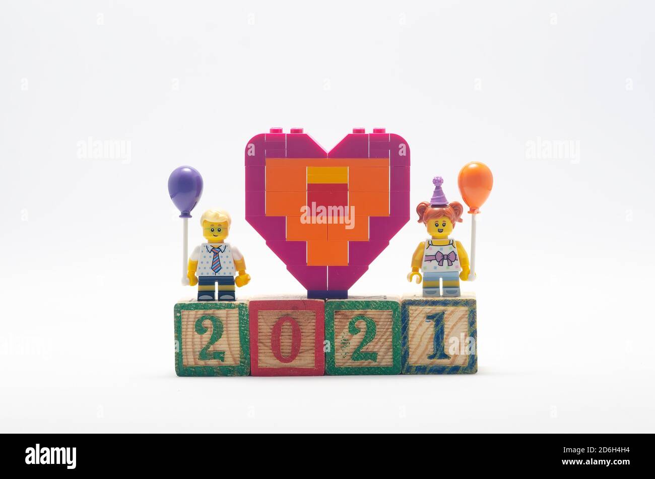 lego minifigure kid and girl celebrating new year 2021, using wooden ...