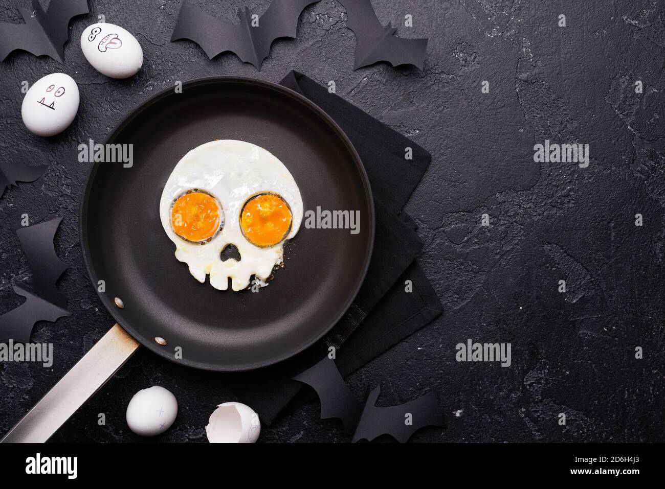 Fried eggs in the shape of a skull. Halloween breakfast Stock Photo - Alamy