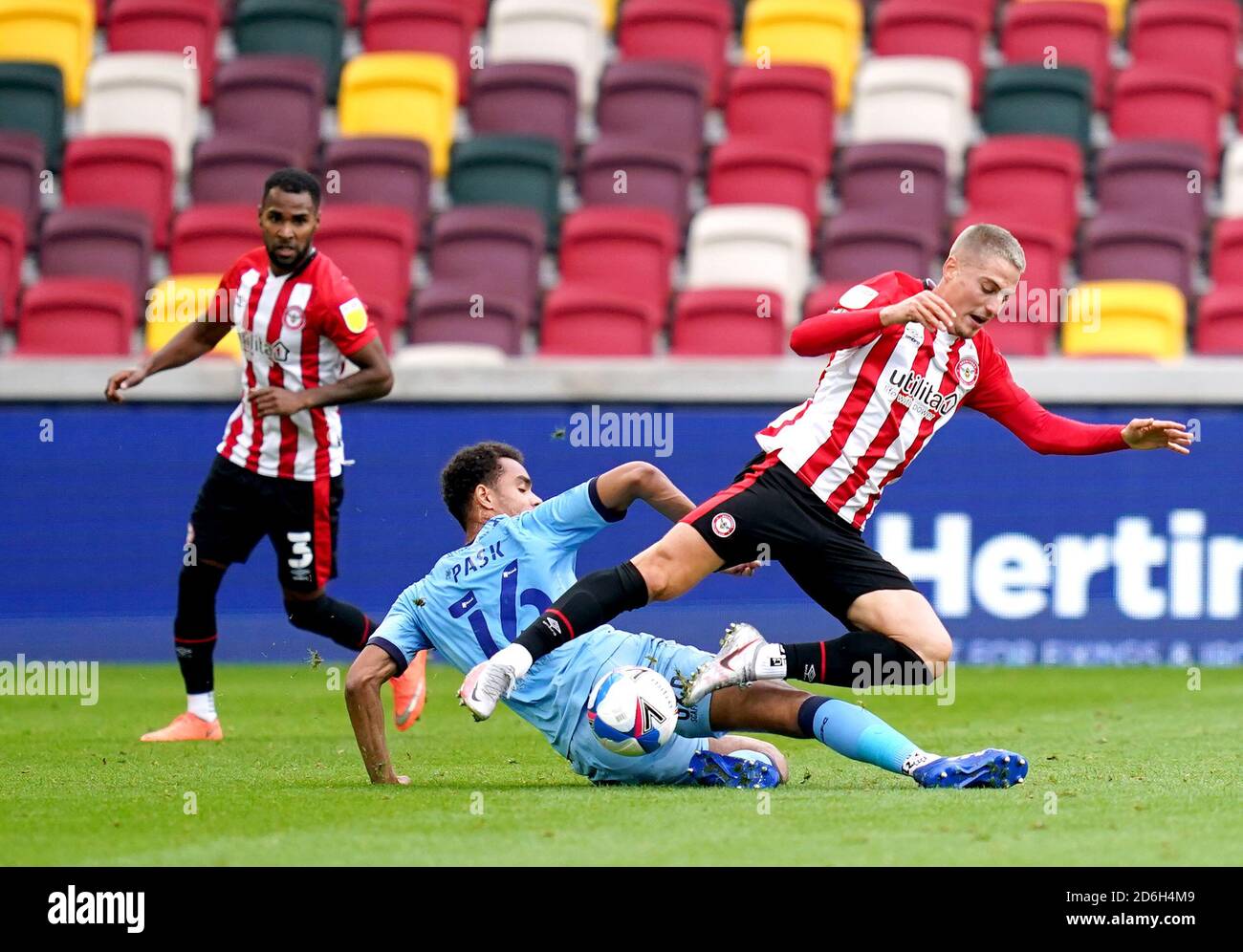 Coventry City's Josh Pask (centre) tackles Brentford's Sergi Canos ...