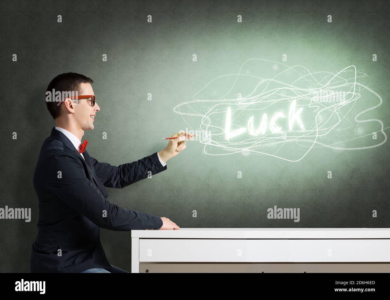 Smart guy draw on wall Stock Photo - Alamy