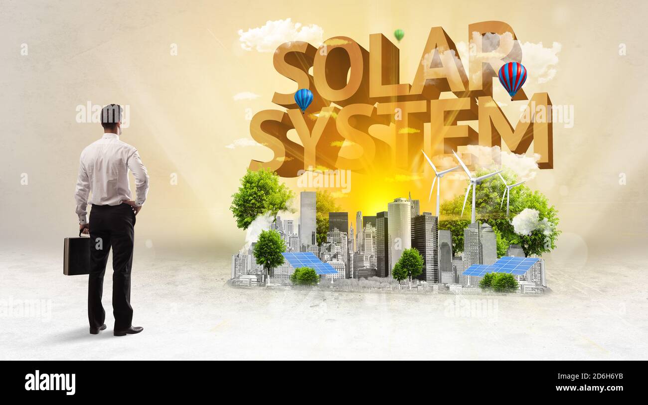 Rear view of a businessman standing in front of SOLAR SYSTEM ...