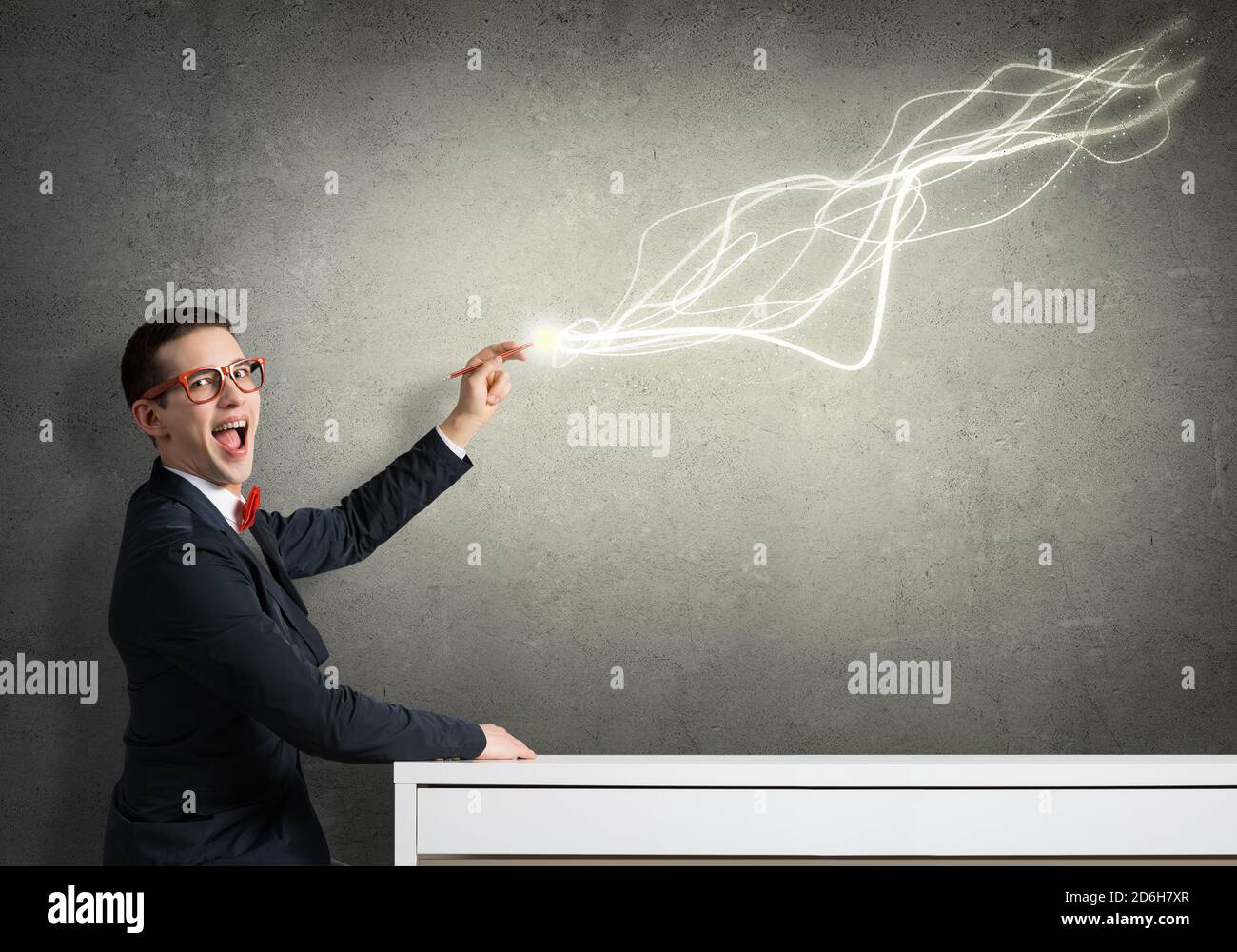 Smart guy draw on wall Stock Photo - Alamy