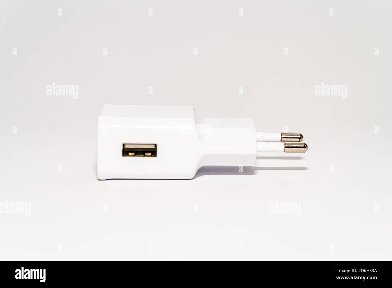 White charger adapter isolated on a white background Stock Photo - Alamy
