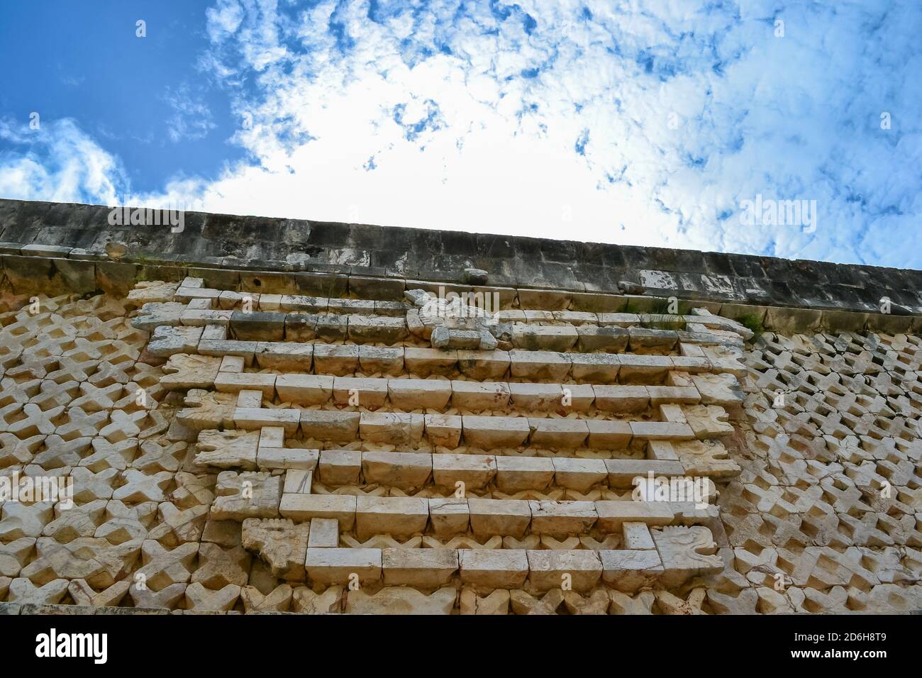 Mayan pyramids and various stone sculptures at the Chicen Itza ...