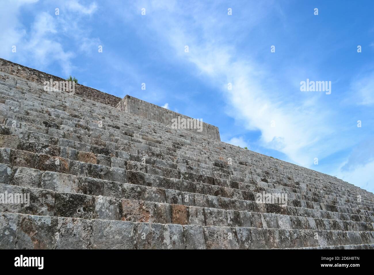 Mayan pyramids and various stone sculptures at the Chicen Itza ...