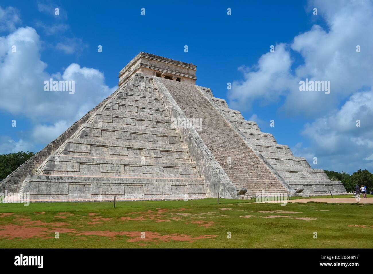 Mayan pyramids and various stone sculptures at the Chicen Itza ...