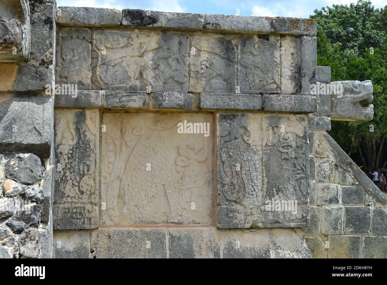 Mayan pyramids and various stone sculptures at the Chicen Itza ...