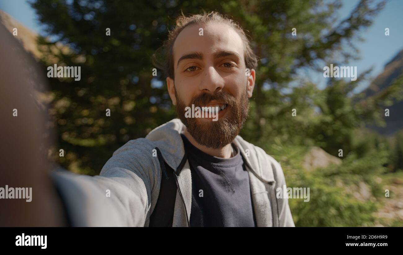 Handsome hiker man video calling hi-res stock photography and images ...