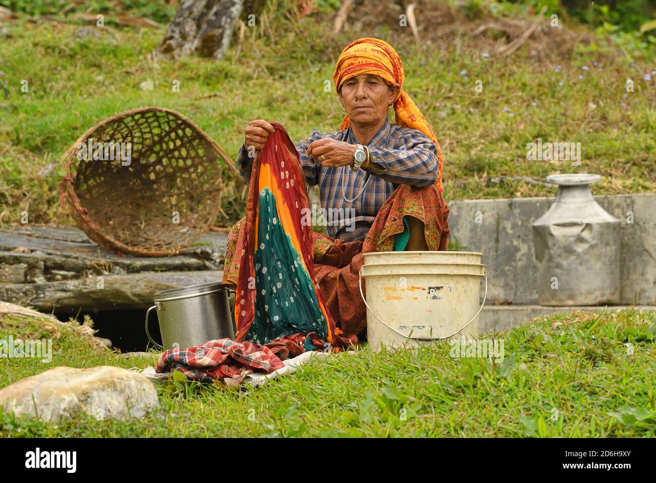Woman washing clothes hi-res stock photography and images - Alamy