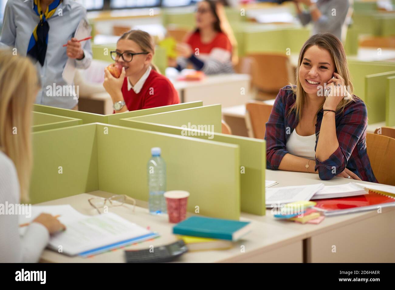 Students enjoying in a break of a lecture in the university classroom ...