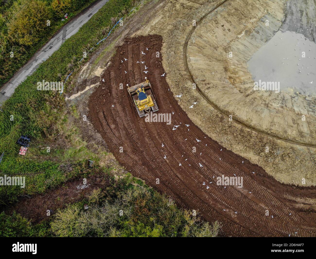Bulldozer flattens land on the construction site of the Sevington ...