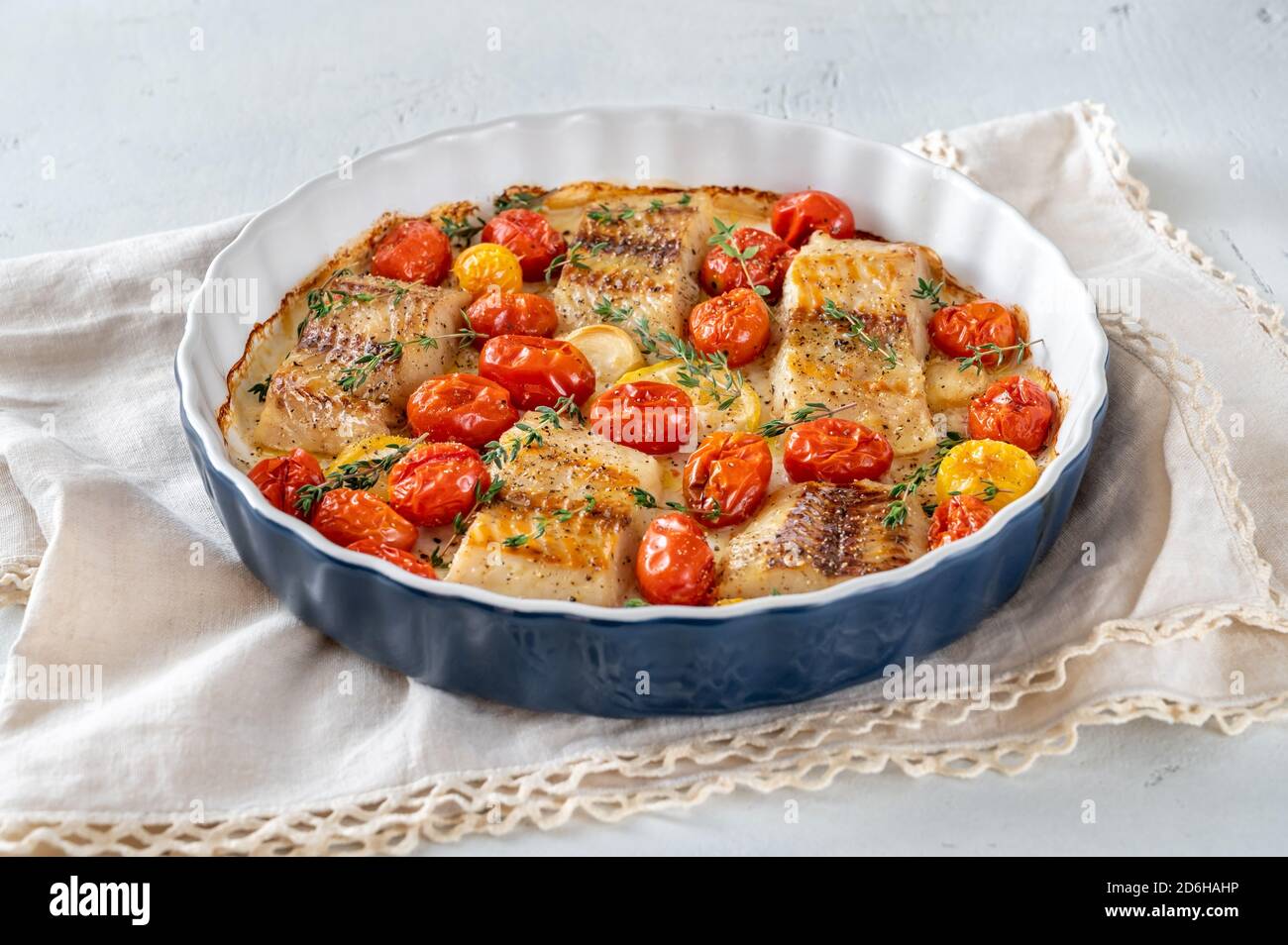 Baked cod and cherry tomatoes hi-res stock photography and images - Alamy