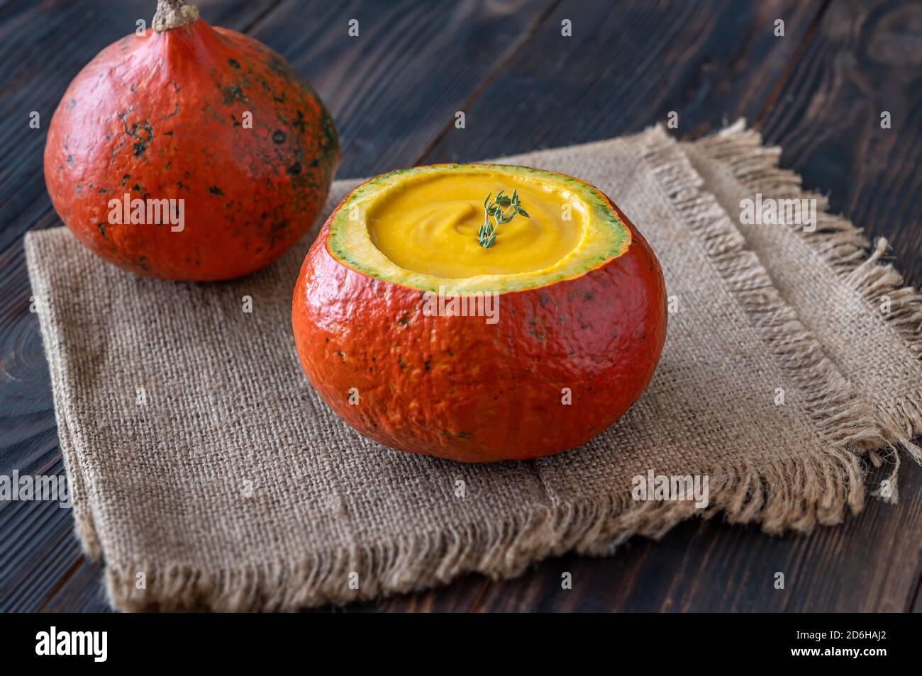 Pumpkin soup served in the hollowed out hokkaido pumpkin Stock Photo ...