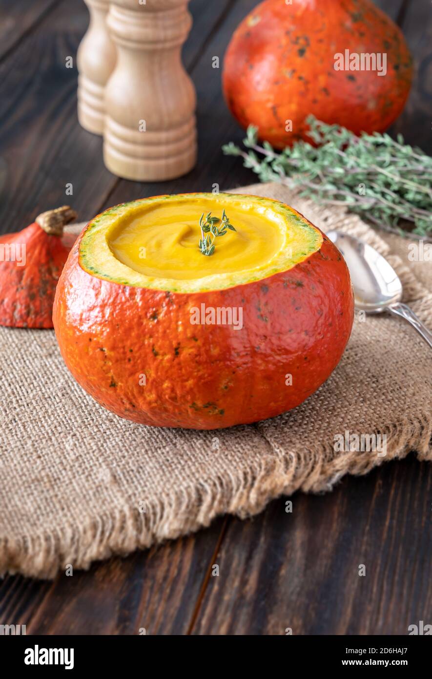Pumpkin soup served in the hollowed out hokkaido pumpkin Stock Photo ...