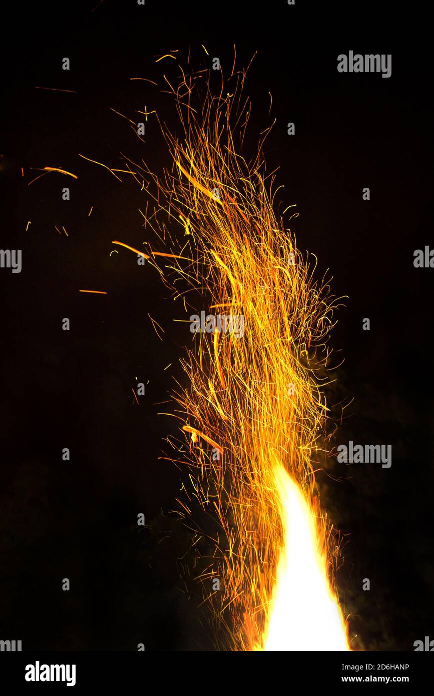 Fire sparks. Top of the fire at the night with sparkles. Orthodox ...