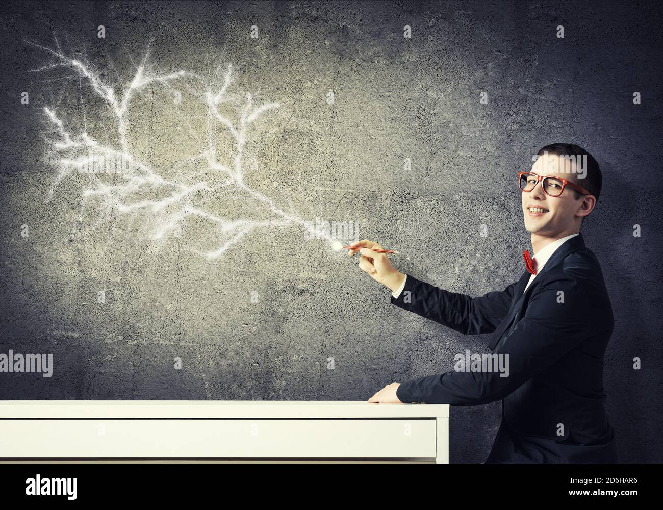 Smart guy draw on wall Stock Photo - Alamy