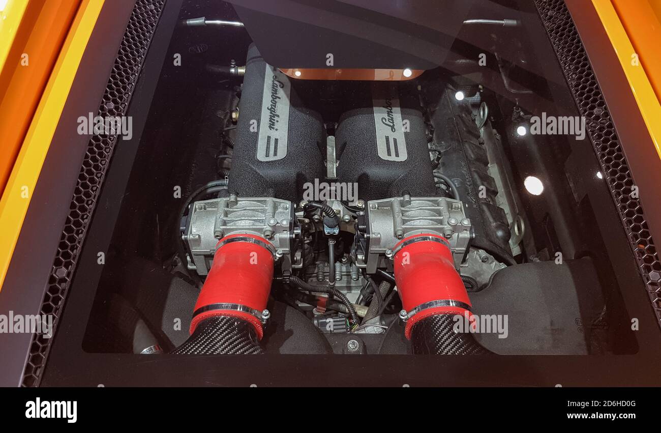 Red with black engine in yellow Lamborghini. Close-up of a glass ...