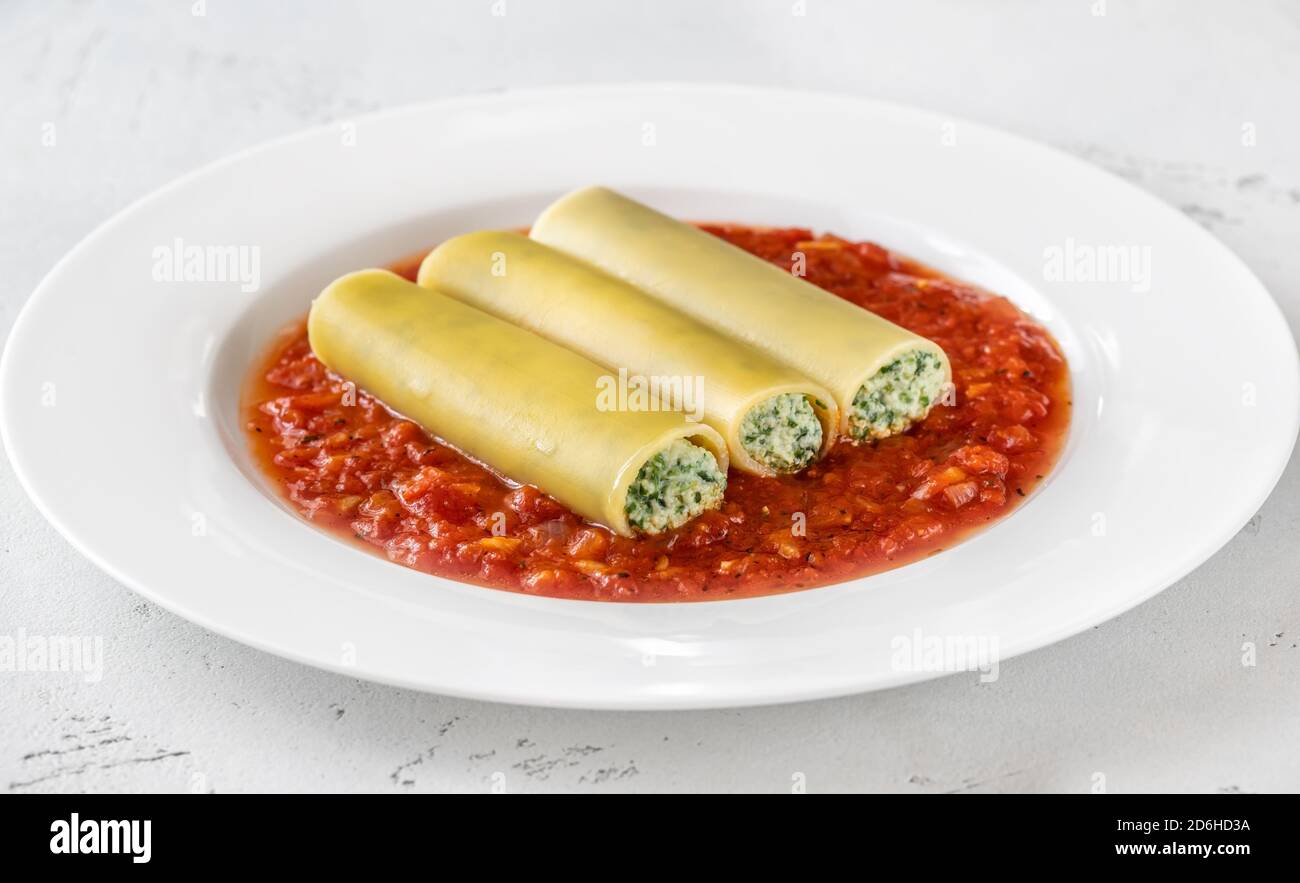 Cannelloni pasta stuffed with ricotta and spinach with tomato sauce ...