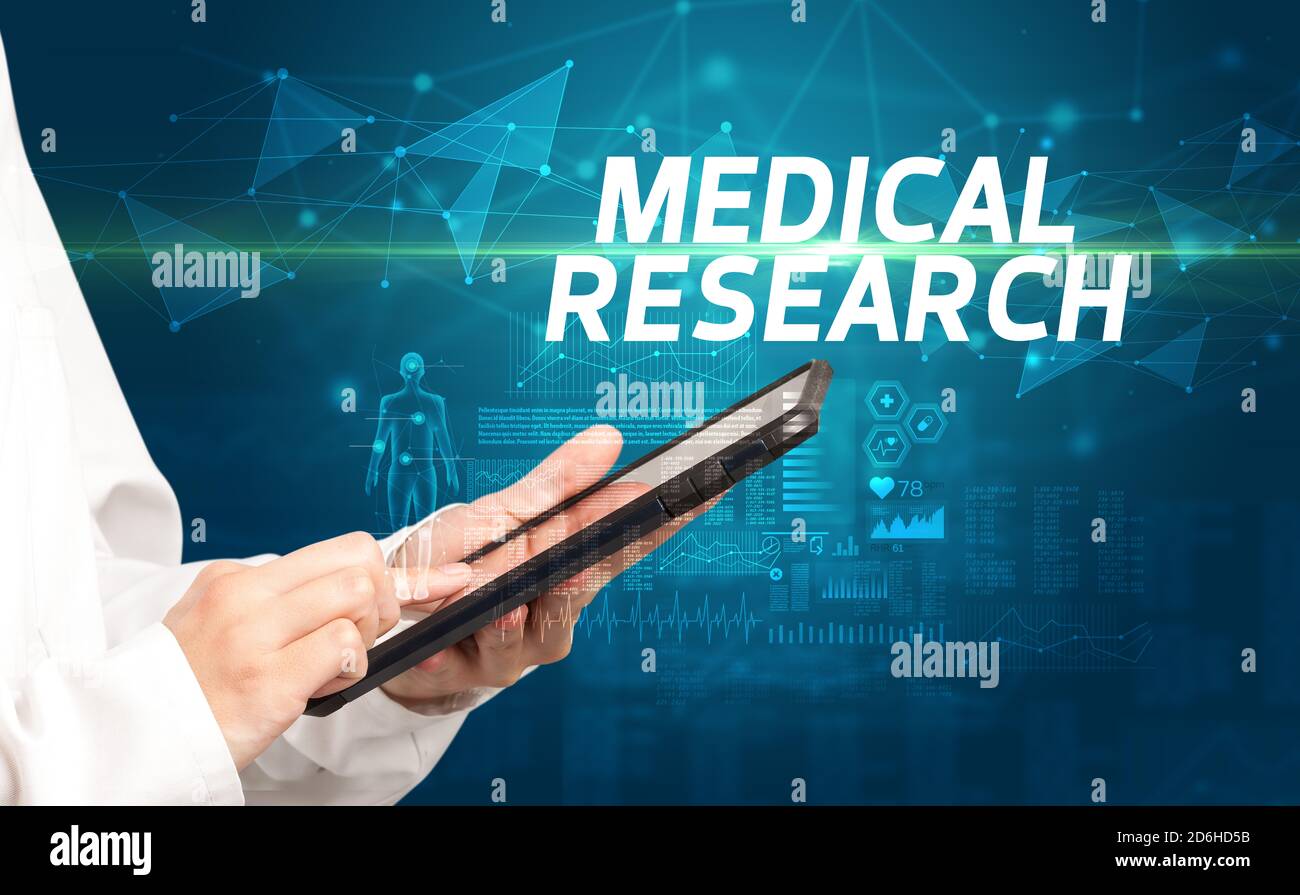 doctor writes notes on the clipboard with MEDICAL RESEARCH inscription ...