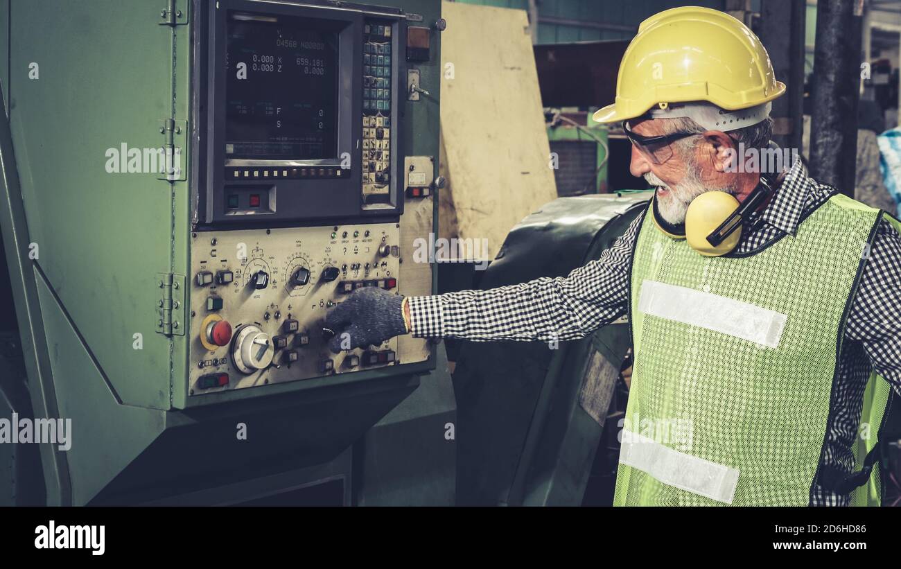 Smart factory worker using machine in factory workshop . Industry and ...