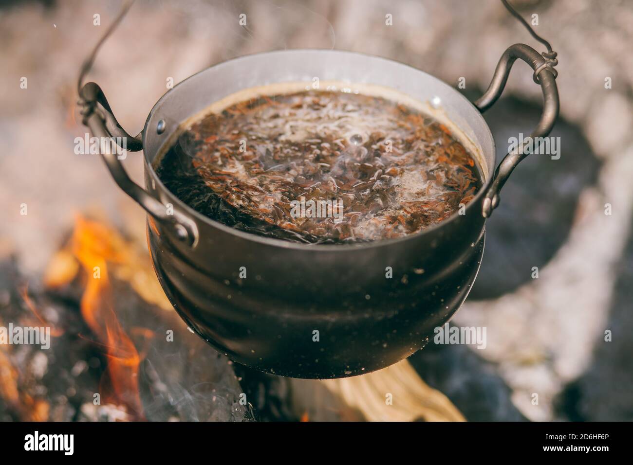Hiking pot, Bowler in the bonfire. soup boils in cauldron at the stake ...