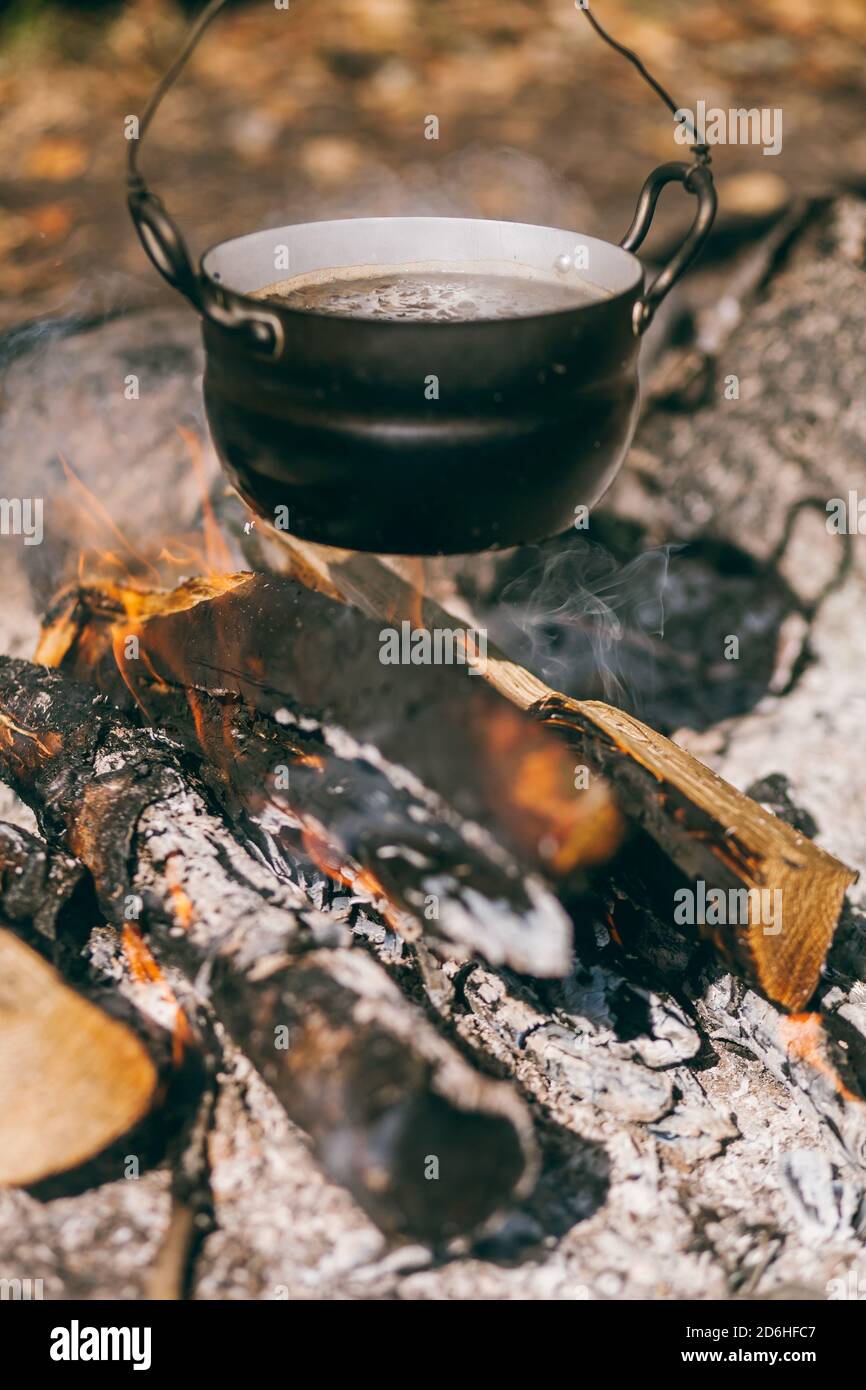 Hiking pot, Bowler in the bonfire. soup boils in cauldron at the stake ...