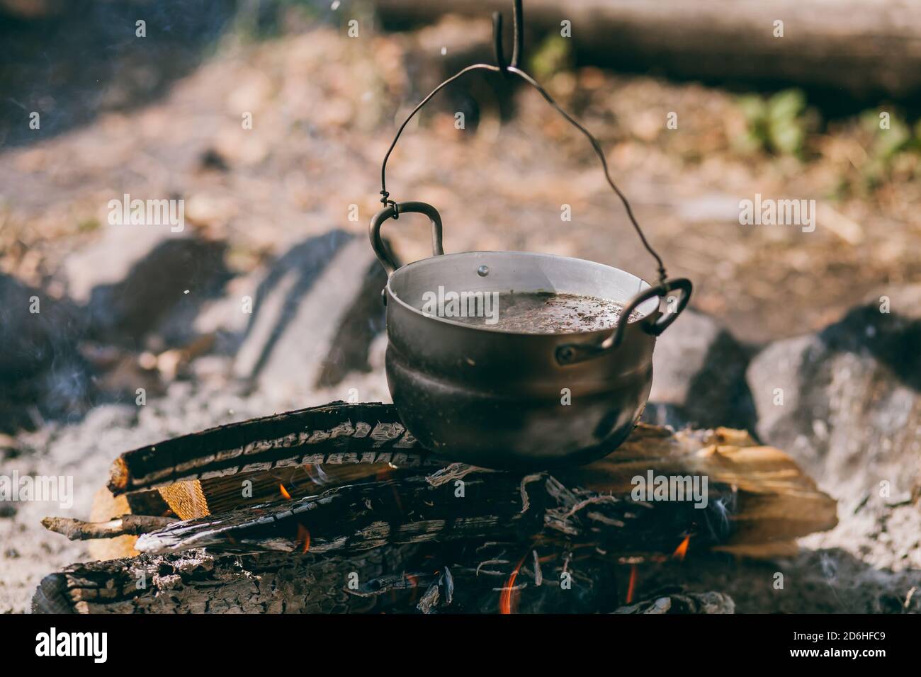 Hiking pot, Bowler in the bonfire. soup boils in cauldron at the stake ...