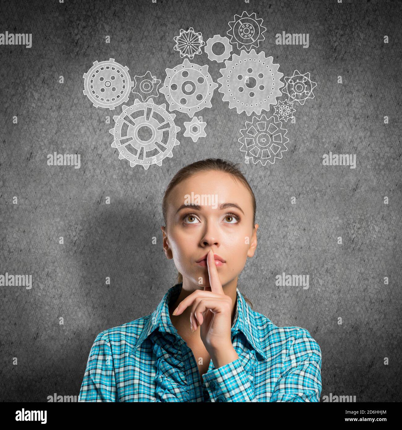 Girl showing hush gesture Stock Photo - Alamy