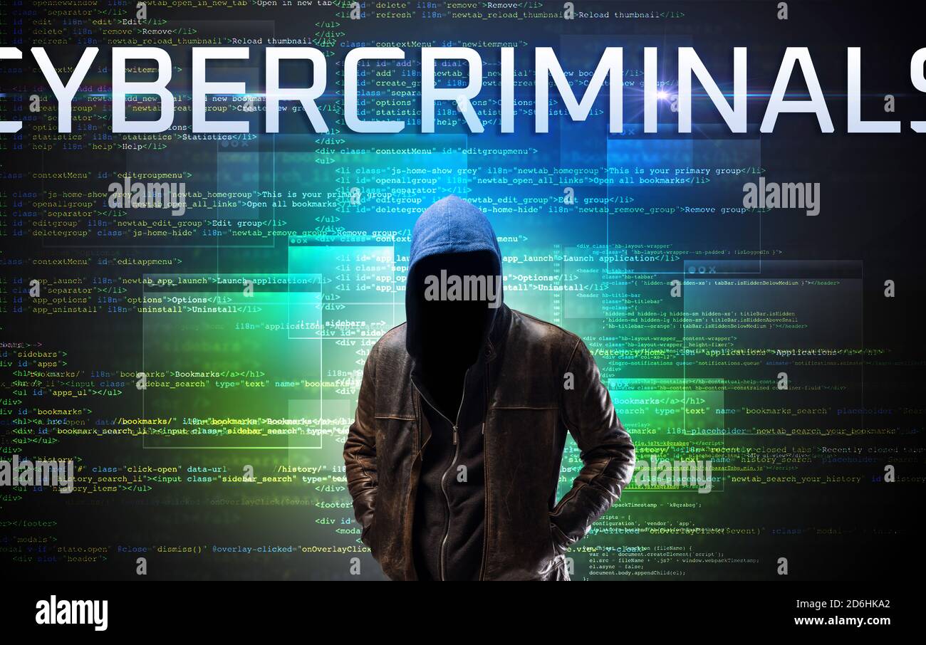 Faceless hacker with CYBERCRIMINALS inscription on a binary code ...