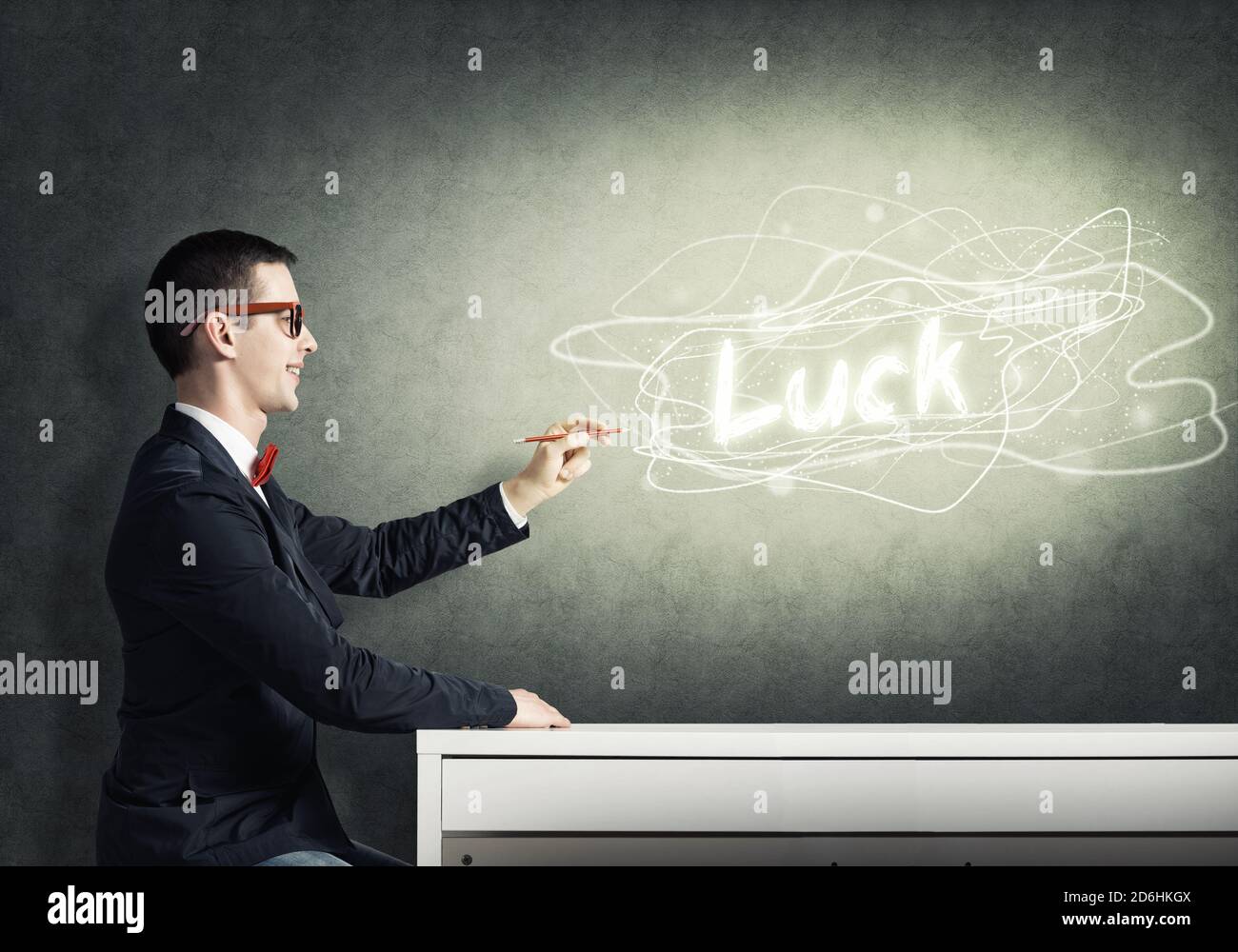 Smart guy draw on wall Stock Photo - Alamy