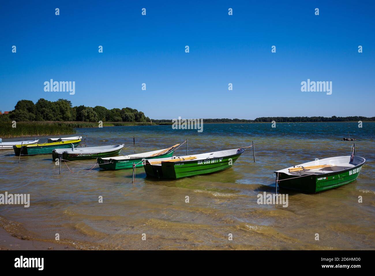 Boats moored by a lake Stock Photo - Alamy