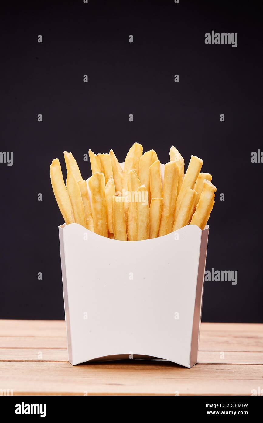 French fries in a white box close-up Stock Photo - Alamy