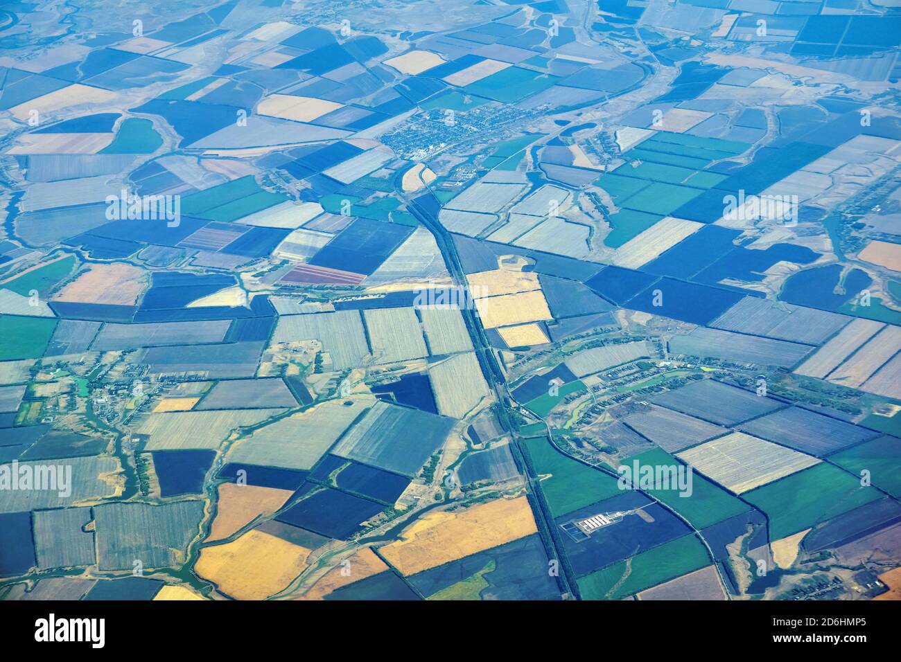 aerial view of a densely populated region with multi-colored fields and ...