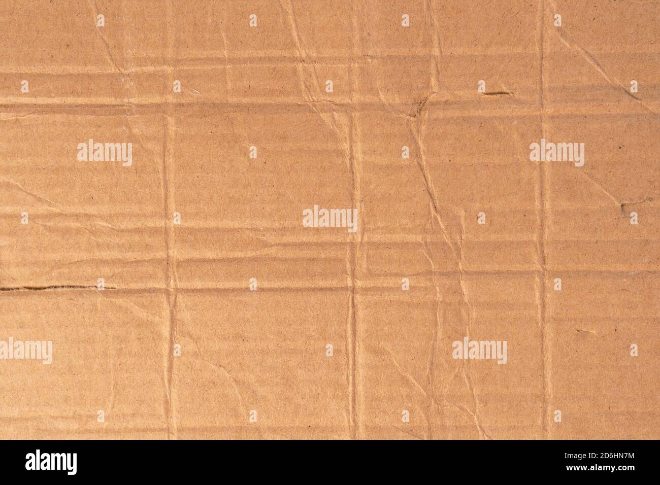 Wrinkled cardboard texture close up, paper packaging background with ...
