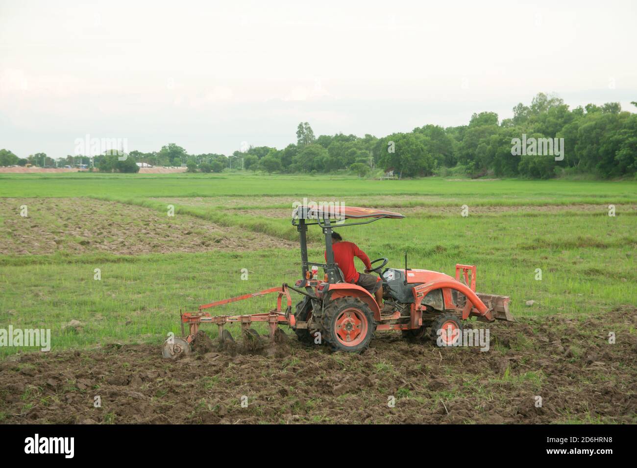 Tractor cultivating big field hi-res stock photography and images - Alamy
