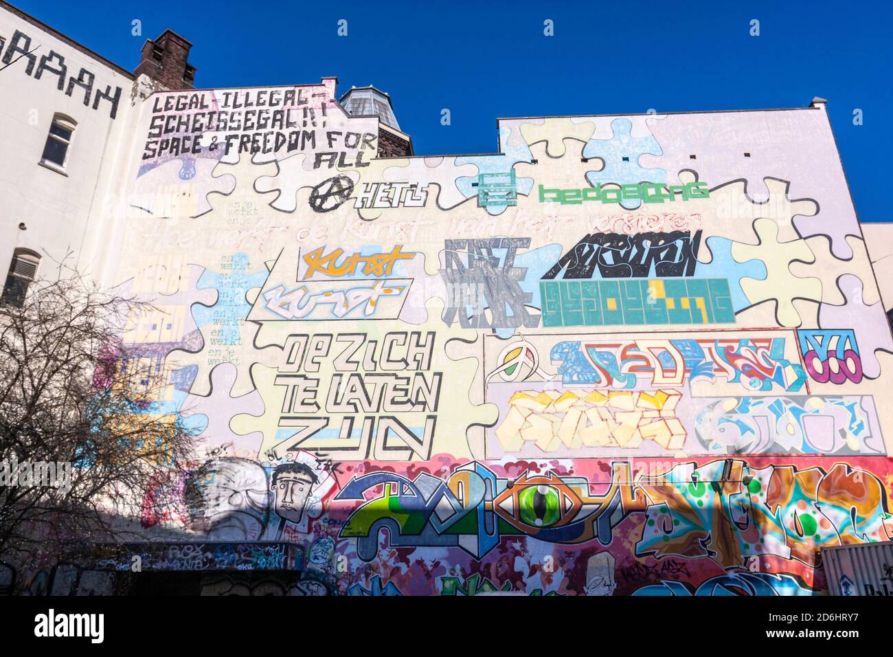 Building wall painted with several different gratifies in Amsterdam ...