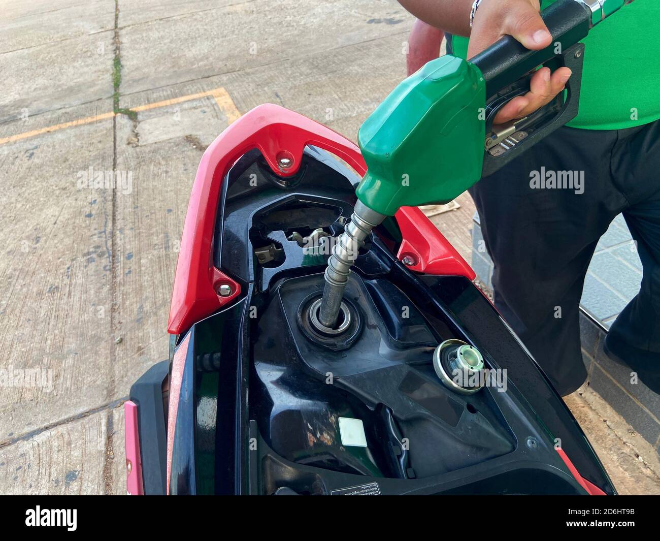 Filling motorcycle tank gas station hi-res stock photography and images ...